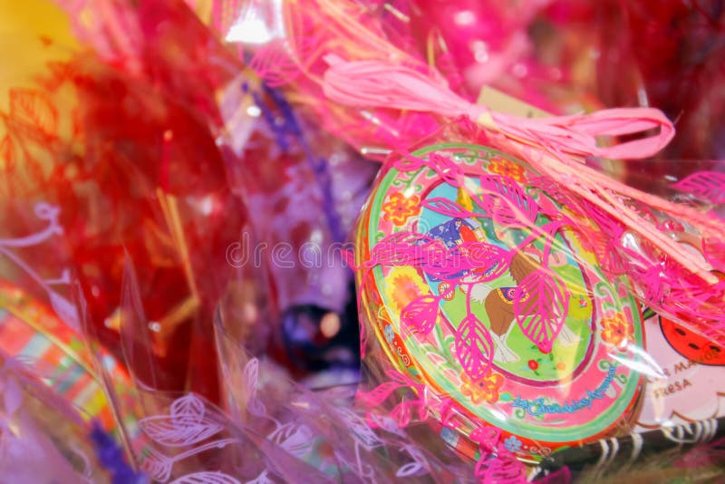 Textured Drawing in a Small Metal Oval Box of Candy with Plastic Wrap ...