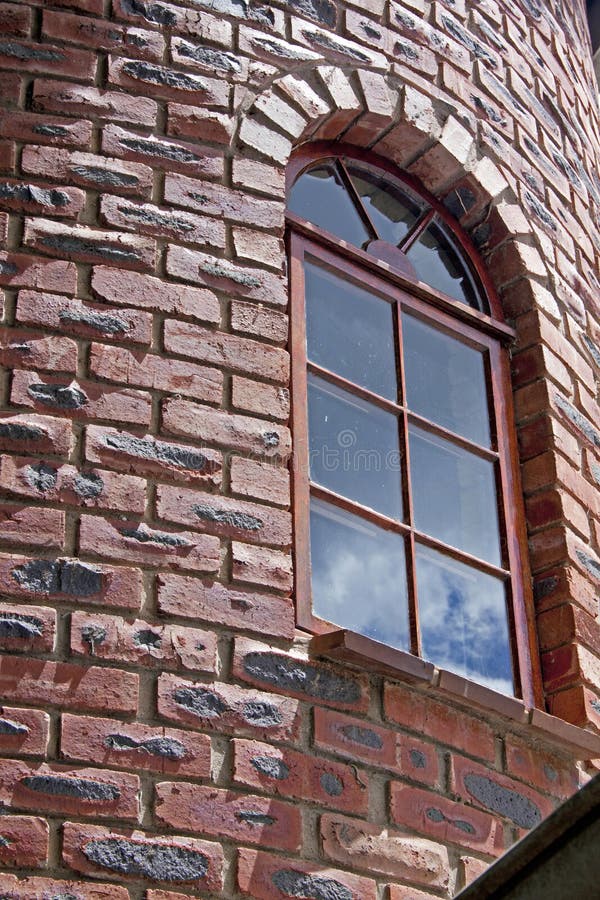 Textured Face Brick Wall of Tower with Arched Window Frame Stock Photo ...
