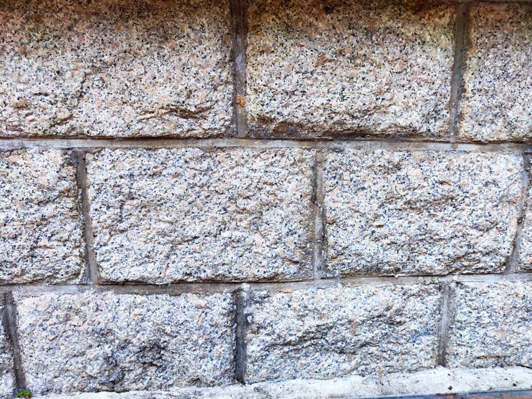 Textured Granite Wall with Rectangular Stones in Natural Light Stock ...