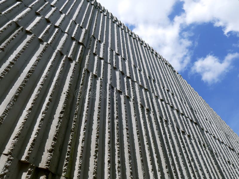 Textured High Stone Wall Corridor Perspective with Blue Sky and Stock ...