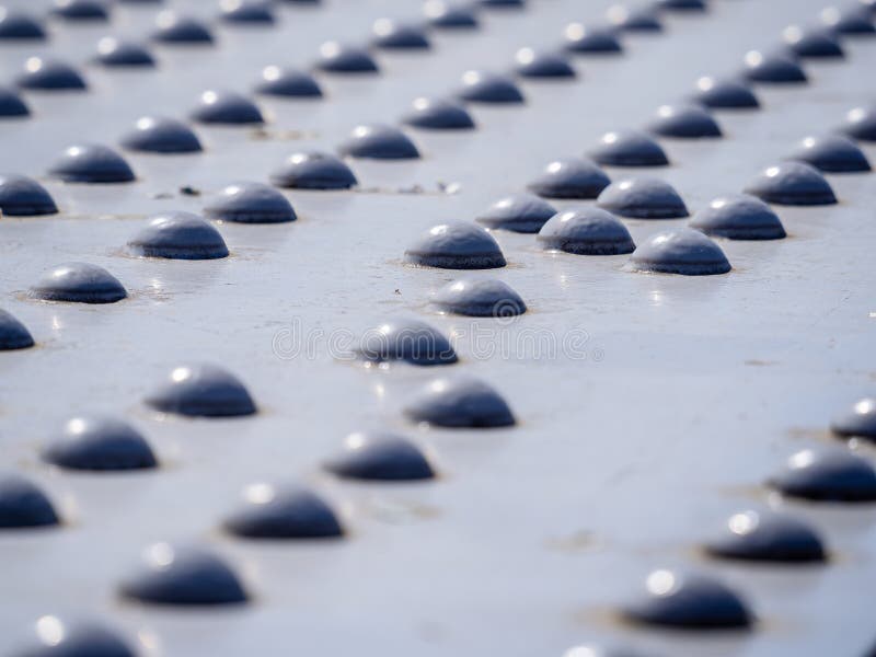 Textured Metal Surface with Raised Bumps Stock Photo - Image of gray ...