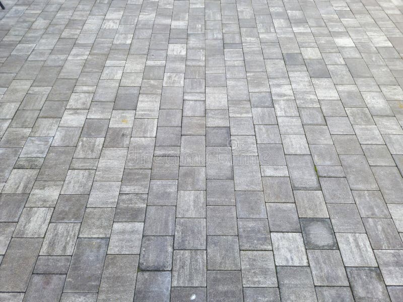 Textured Paved Surface Featuring Gray Stones Arranged in a Geometric ...