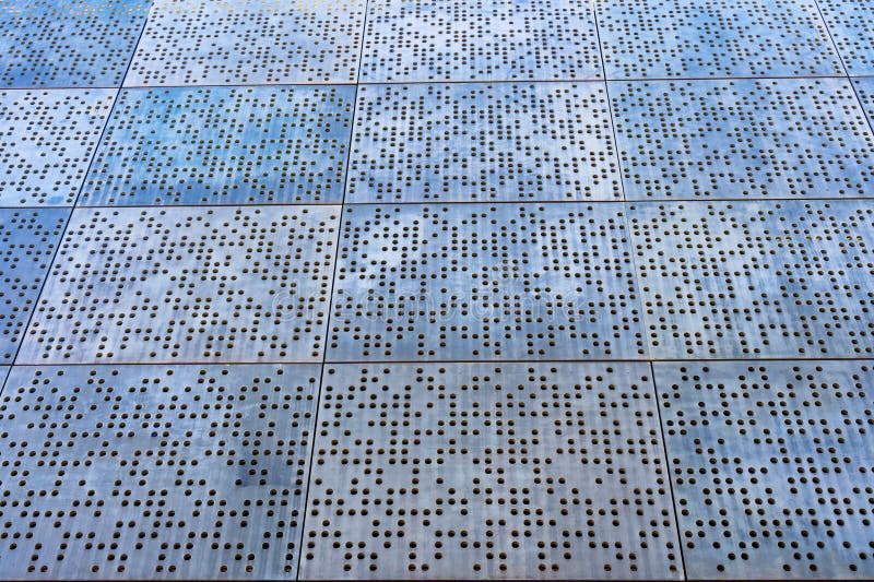 Textured Perforated Metal Wall with Unique Patterns Stock Image - Image ...