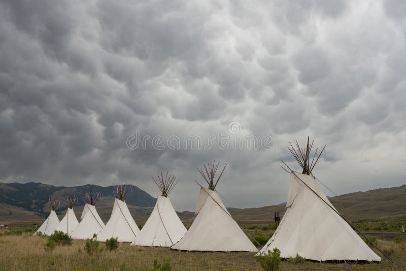 Textured Rain Clouds Build Over Seven Teepees on Display in Gardiner ...