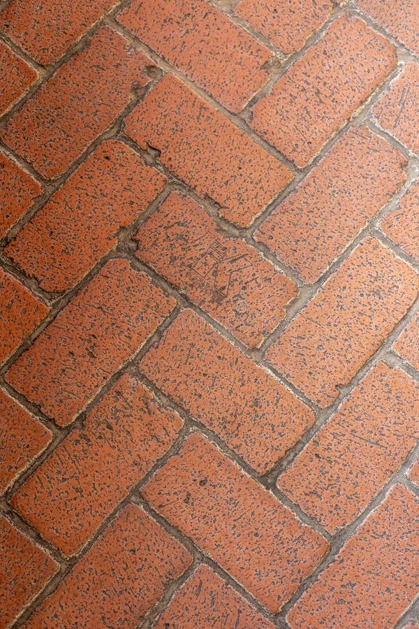 Textured Red Brick Pavement Featuring a Herringbone Pattern in a Sunny ...