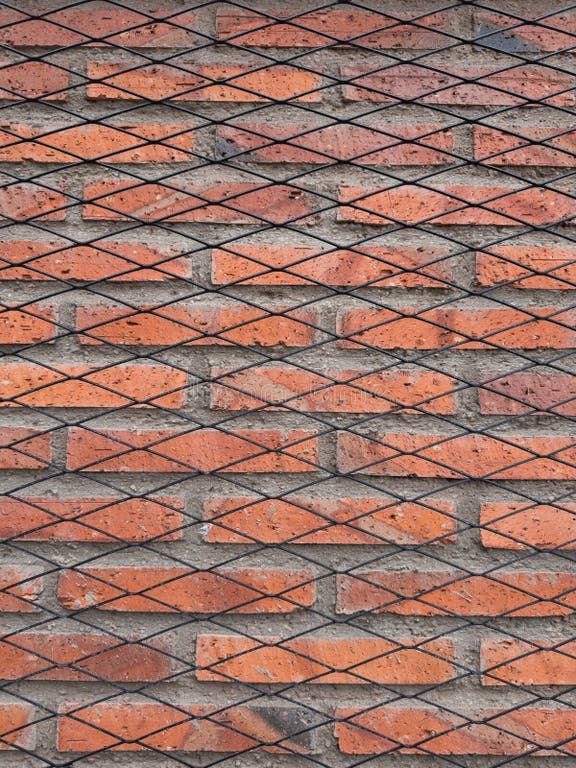 Textured Red Brick Wall with Black Diagonal Patterns for Background ...