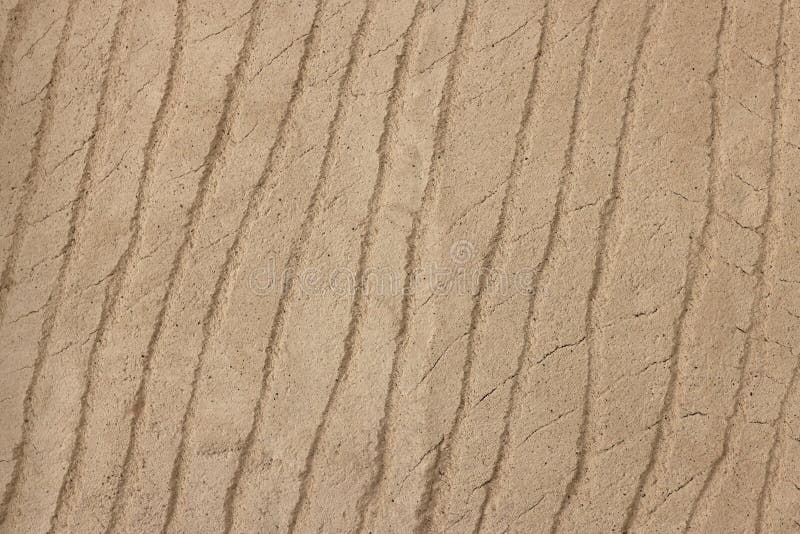 Textured Sandy Color Surface of Cement Plaster with Thin Cracks on a ...