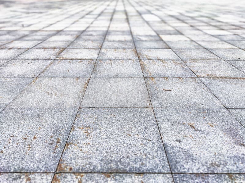 Textured Stone Tiles Create a Captivating Perspective on a Weathered ...