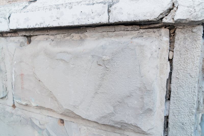 Textured Stone Wall with Cracks and Erosion Effects in Soft Natural ...