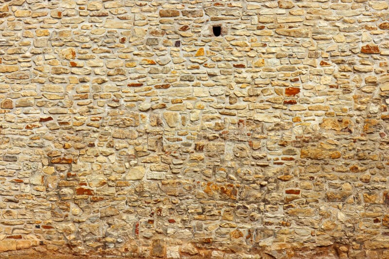 Textured Stone Wall with Natural Colors and Rough Surface. Stock Image ...