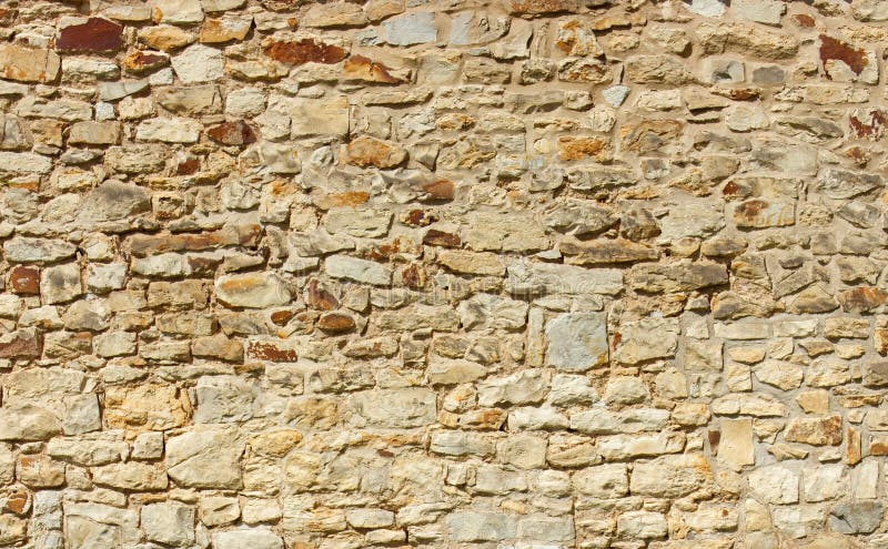 Textured Stone Wall with Natural Colors and Rough Surface Stock Photo ...