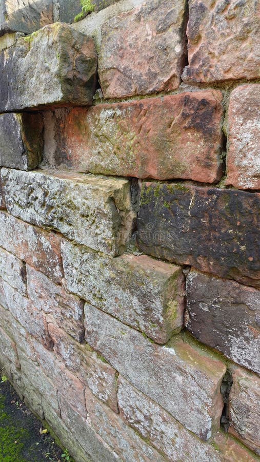 Textured Stone Wall Showcasing Ancient Masonry Techniques in a Historic ...