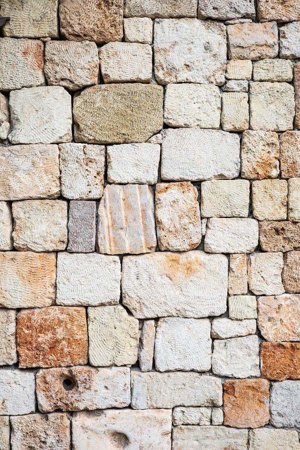 Textured Stone Wall with Varied Colored Bricks in a Rustic Pattern Stock Image - Image of ...