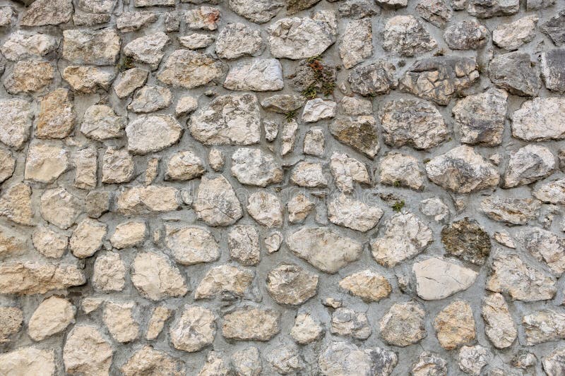 Textured Stone Wall with Varied Rock Sizes and Shades Stock Image ...