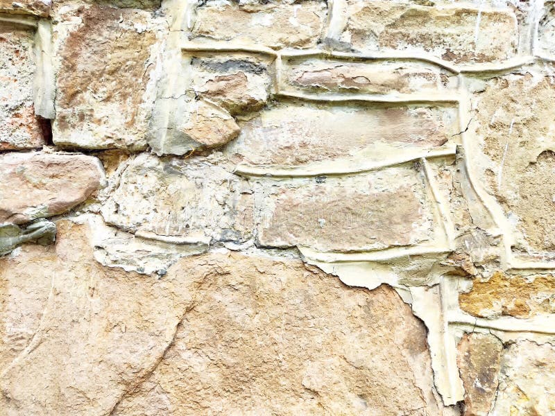 Natural Stone Wall Texture Featuring Irregular Shapes and Earthy Tones ...