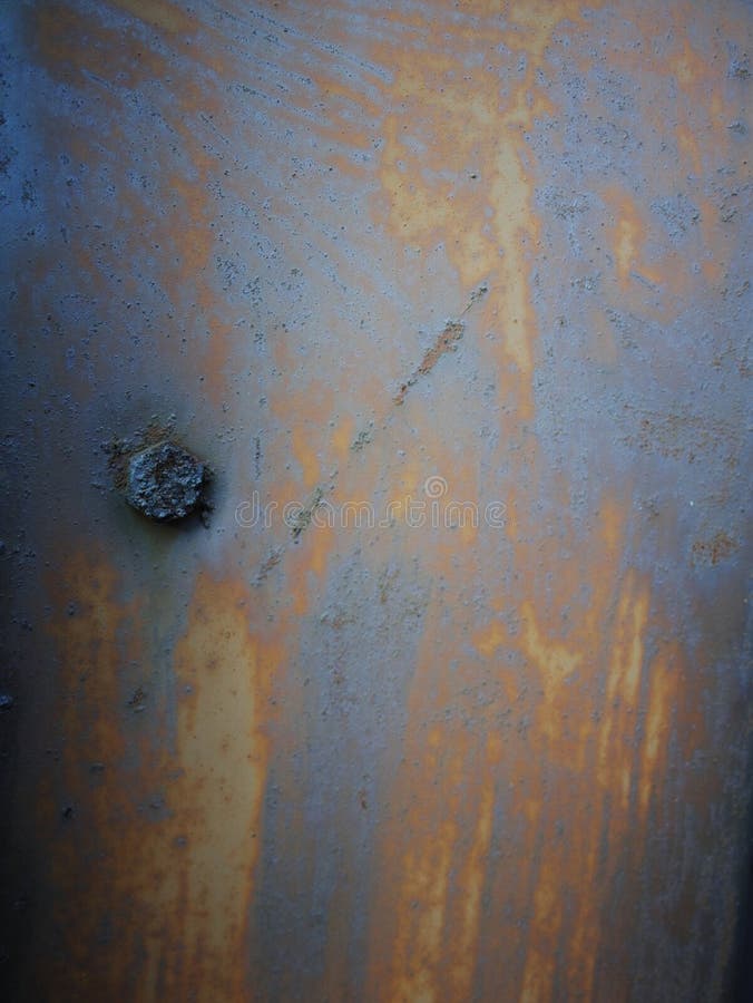 Textured Surface with Rust Patterns and a Distinct Hole. Stock Photo ...