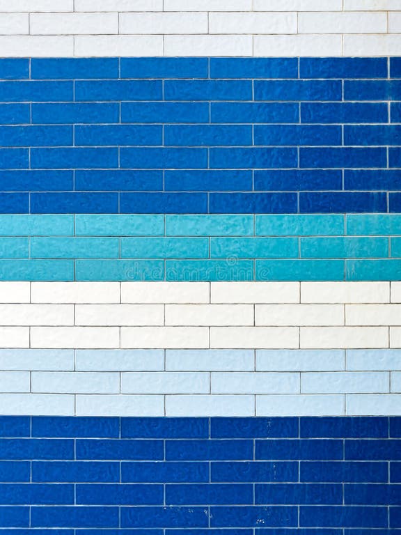 A Textured Wall Featuring Rectangular Tiles in a Mosaic of Various Blue ...