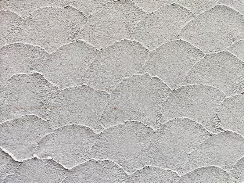 Textured Wall Featuring a Unique Pattern with Curved Shapes Ideal for ...