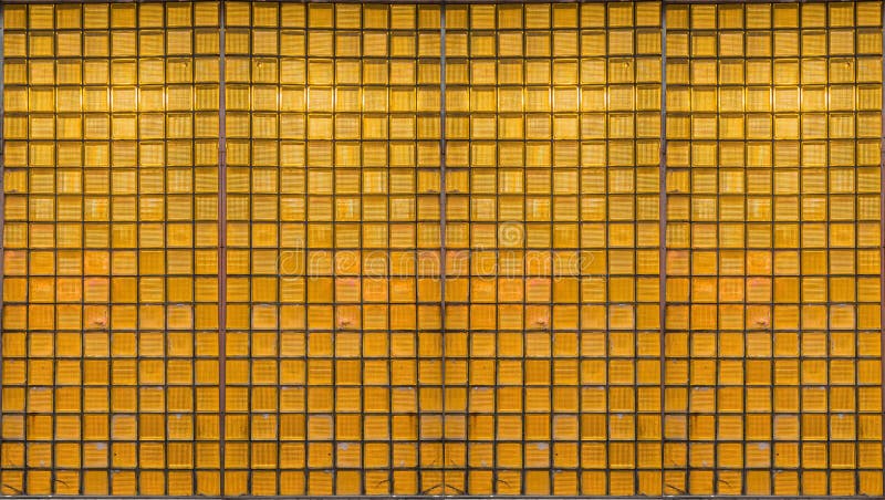 Textured Wall of Glass Blocks, Illuminated by a Warm Yellow, Lamp Light ...