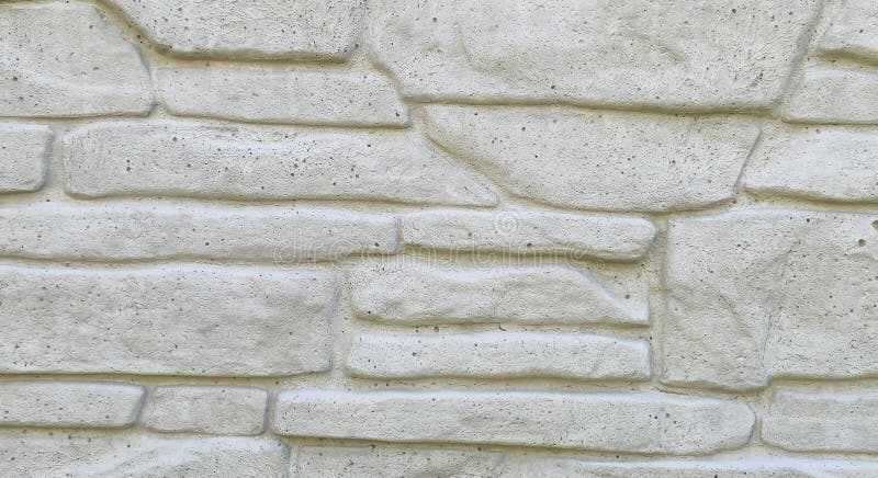 Textured Wall Made of Light-colored Stone Blocks, Showcasing a Unique ...