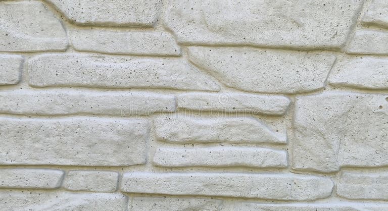 Textured Wall Made of Light-colored Stone Blocks, Showcasing a Unique ...