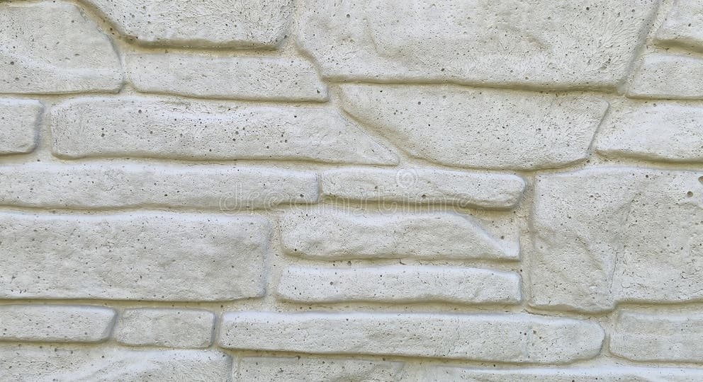 Textured Wall Made of Light-colored Stone Blocks, Showcasing a Unique ...