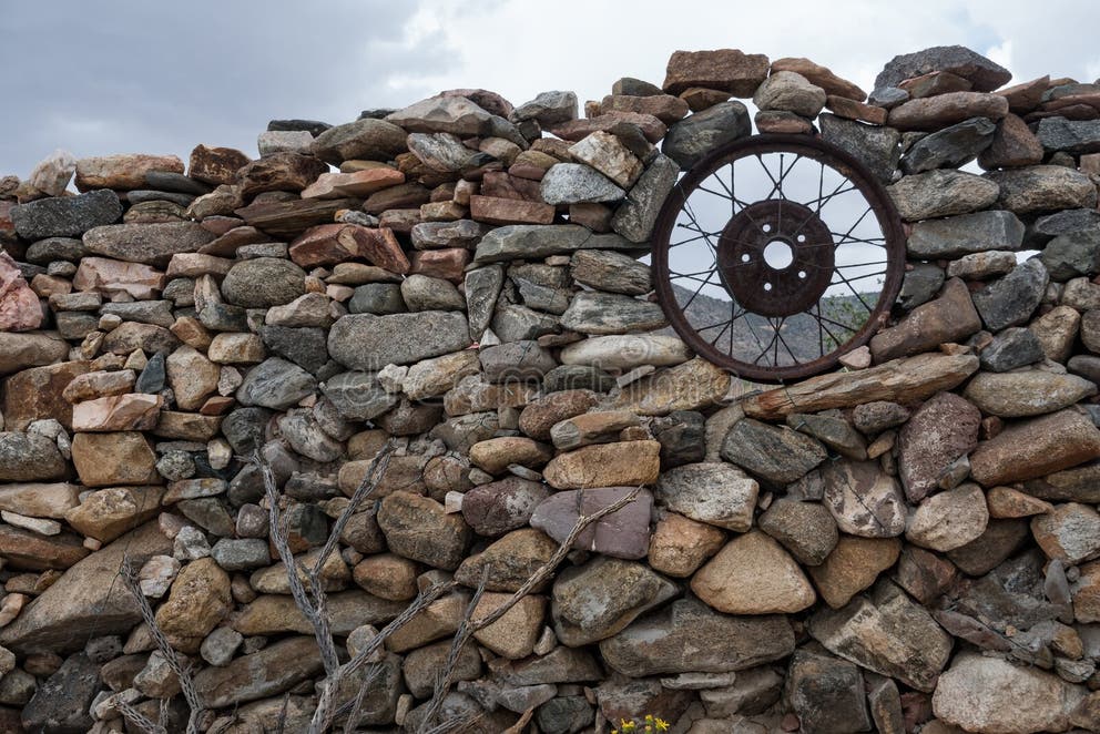 Textures and a Wheel, Rock Wall Stock Image - Image of artistic, joints ...