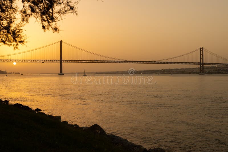25th of April Bridge - Sunset Over Tejo River in Lisbon Stock Image ...