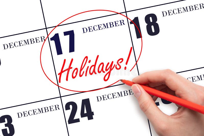 Hand Drawing a Red Circle and Writing the Text Holidays on the Calendar ... Hand Drawing a Red Circle and Writing the Text Holidays on the Calendar ...