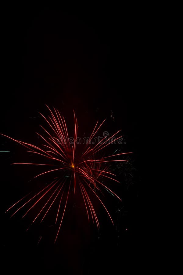 Fireworks in the night sky stock photo. Image of garden - 189497108