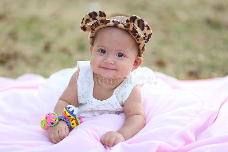 Thai Baby Smiling in the Evening the Playing Field. Stock Photo - Image ...