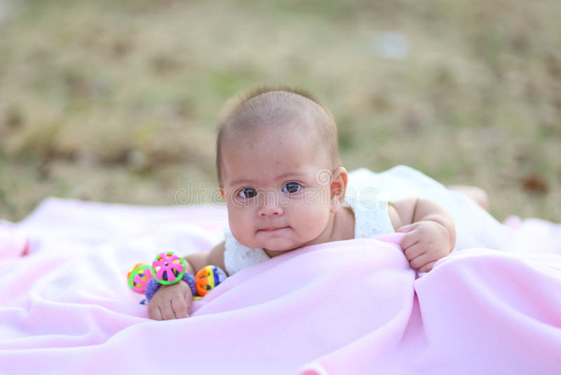 Thai Baby Smiling in the Evening the Playing Field. Stock Image - Image ...