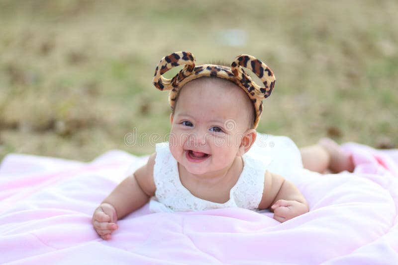 Thai Baby Smiling in the Evening the Playing Field. Stock Image - Image ...