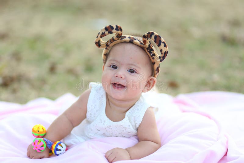 Thai Baby Smiling in the Evening the Playing Field. Stock Image - Image ...