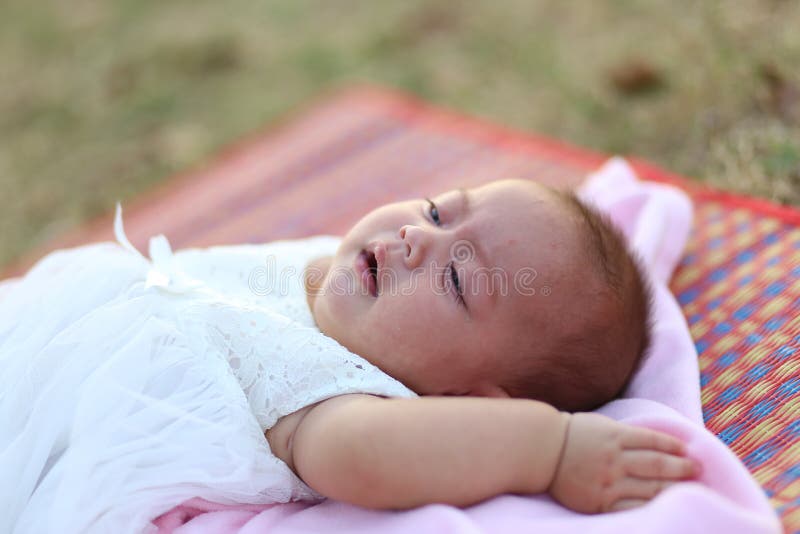 Thai Baby Smiling in the Evening the Playing Field. Stock Image - Image ...