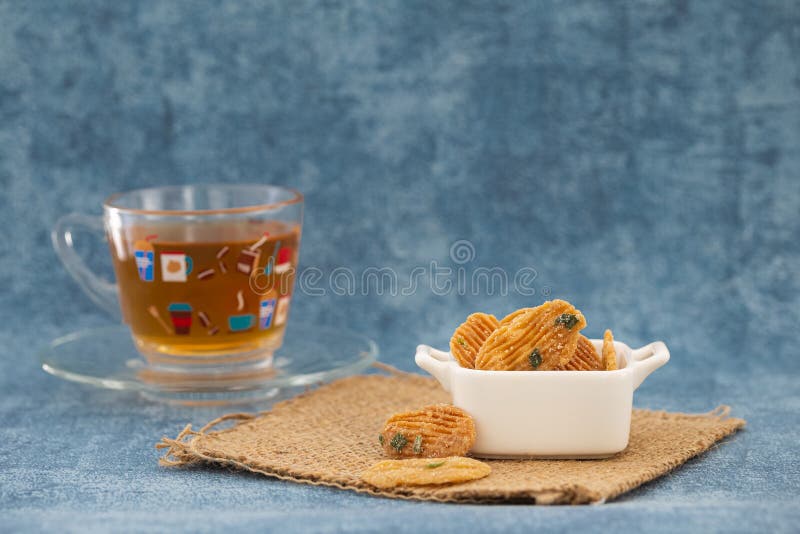 Thai Crispy Salted Chips with Hot Tea Stock Image - Image of bowl, blue ...