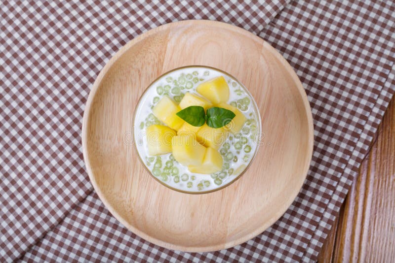 Thai Dessert of Tapioca Pearls Pudding with Mango Stock Photo - Image ...