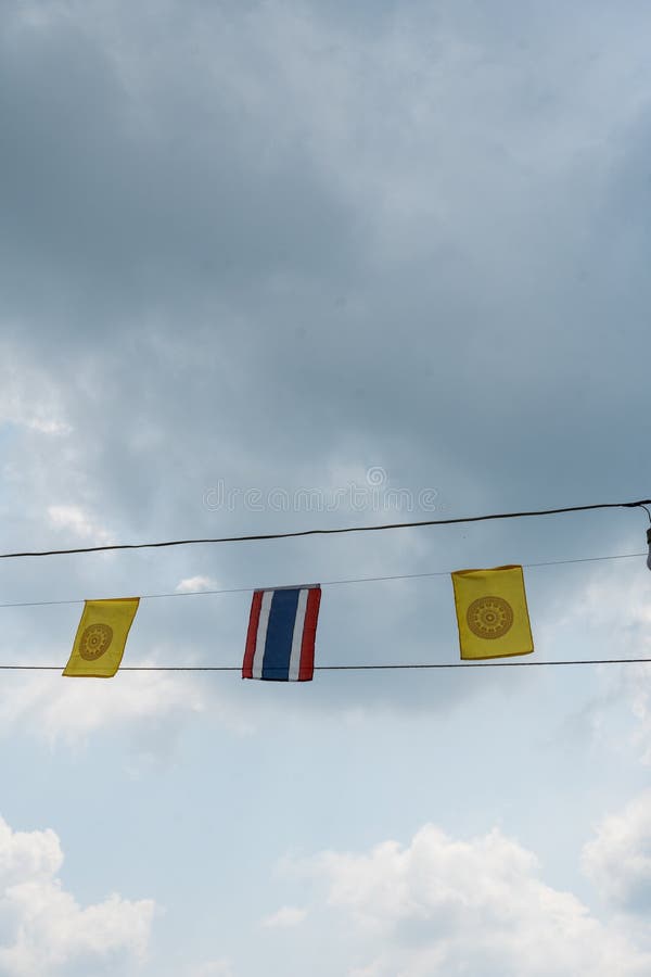 Thai Dharmachakra Buddhist Flags and Thai Nation Flags Waving in the ...