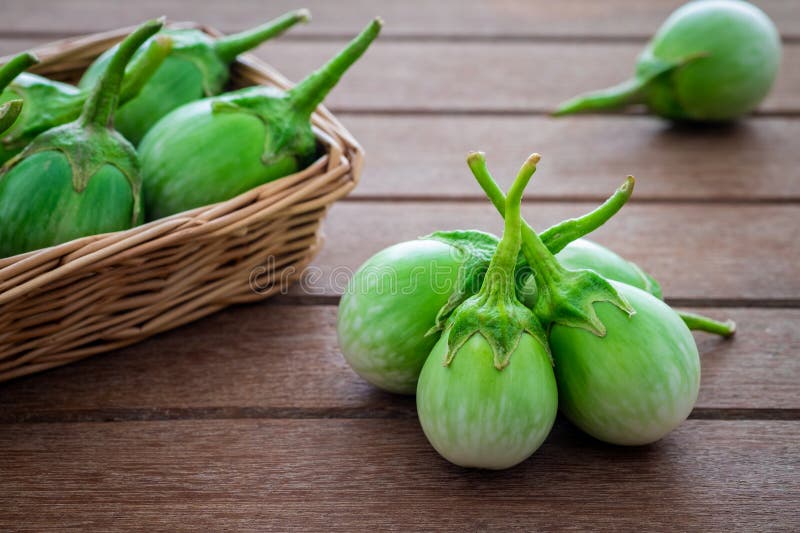 Thai Eggplant or Green Brinjal on Wooden Table Stock Image - Image of ...
