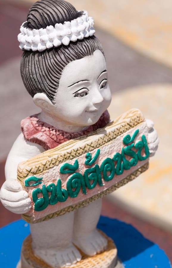 A Thai Figure Holds Signpost Stock Image - Image of signpost, coloured ...