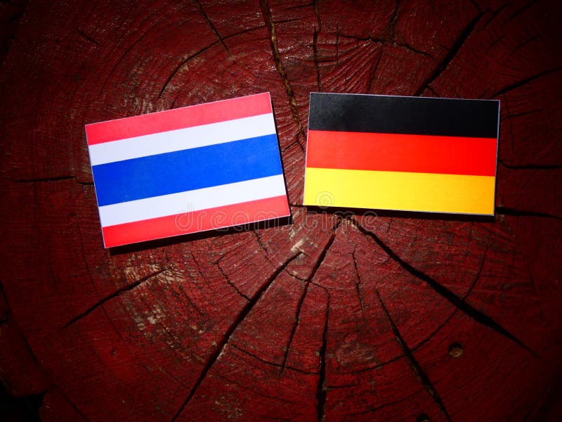 Thai Flag with German Flag on a Tree Stump Stock Photo - Image of ...