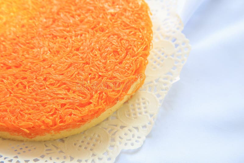 Thai Gold Egg Yolk Thread Chiffon Cake on a White Paper Plate Stock ...