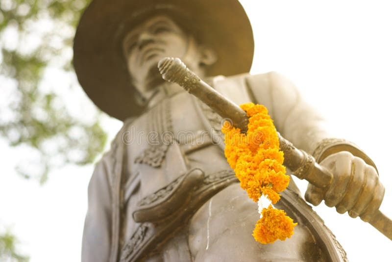 Thai King Statue with Marigold on Sword Stock Photo - Image of fight ...