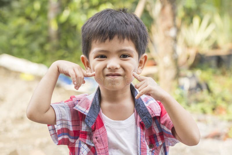 Thai Little Boy Point His Cheek Stock Image - Image of smile, relax ...