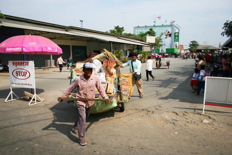 Man Pulls a Cart Along the Road, Thailand. Editorial Image - Image of ...