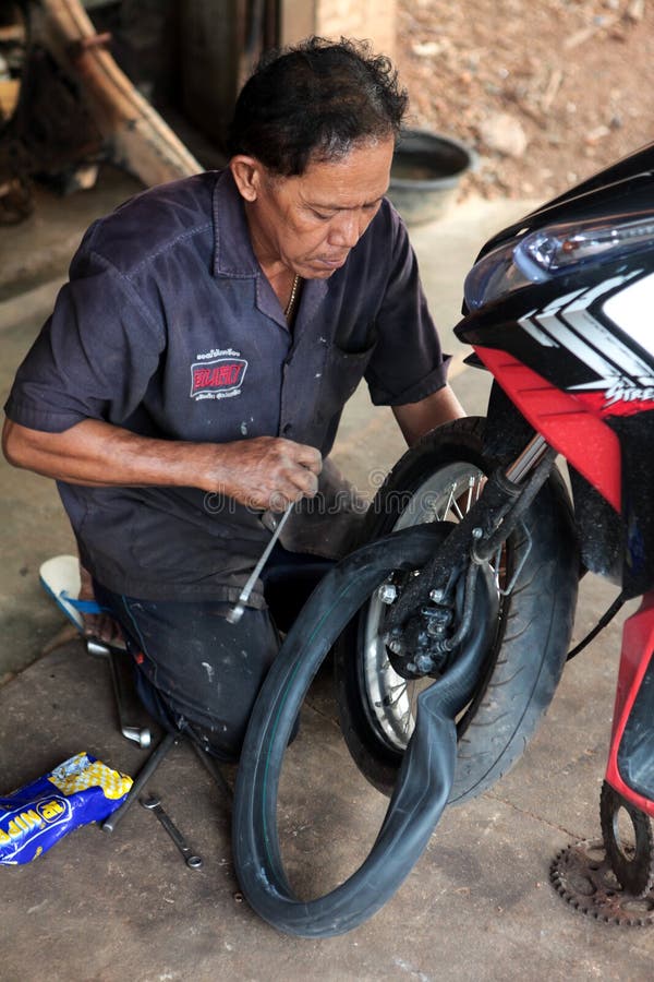 Thai Man Repairing Motorcycle Stock Photos - Free & Royalty-Free Stock ...