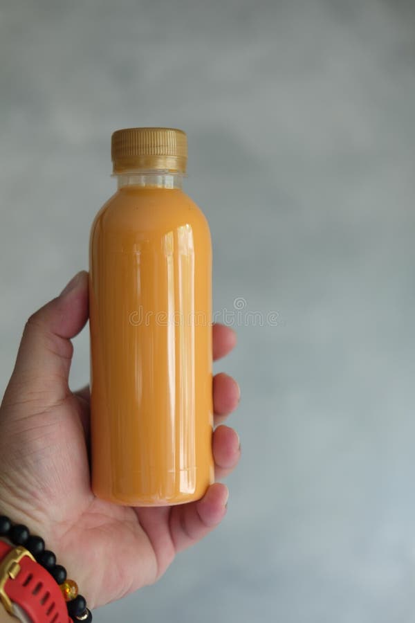 Thai Milk Tea in Plastic Bottle on Man Hand Stock Image - Image of ...