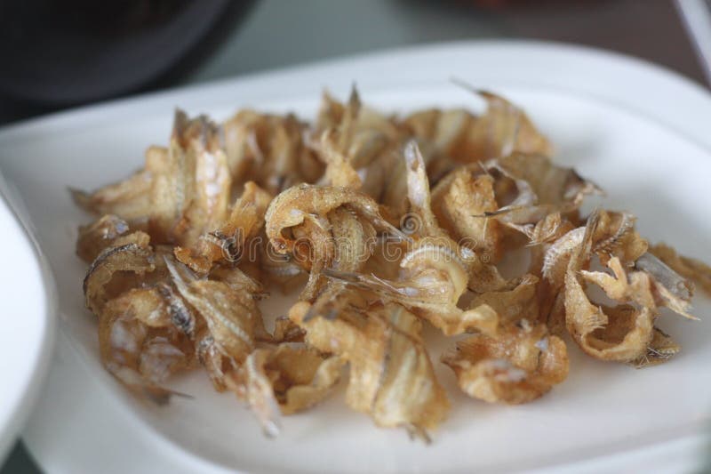 Thai River Sprat Fried Serve on the White Ceramic Plate. Stock Photo ...