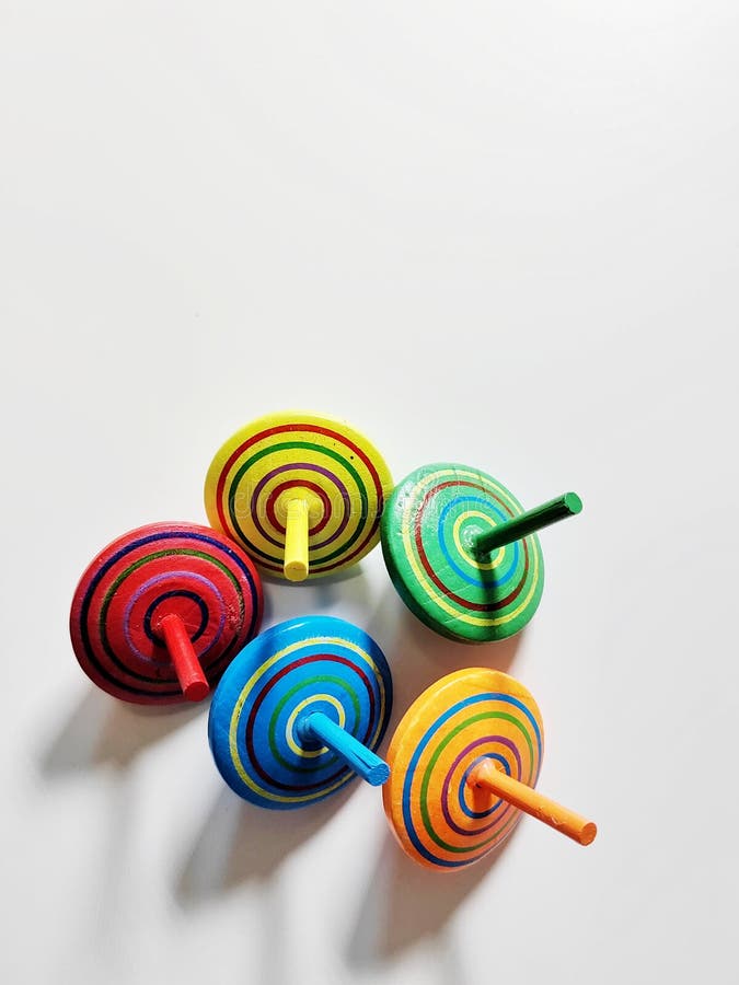 Spinning tops on white stock photo. Image of design - 267133088