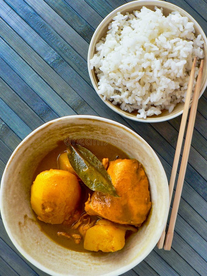 Thai-style Chicken Curry with Coconut Milk and Boiled Rice in a Metal ...